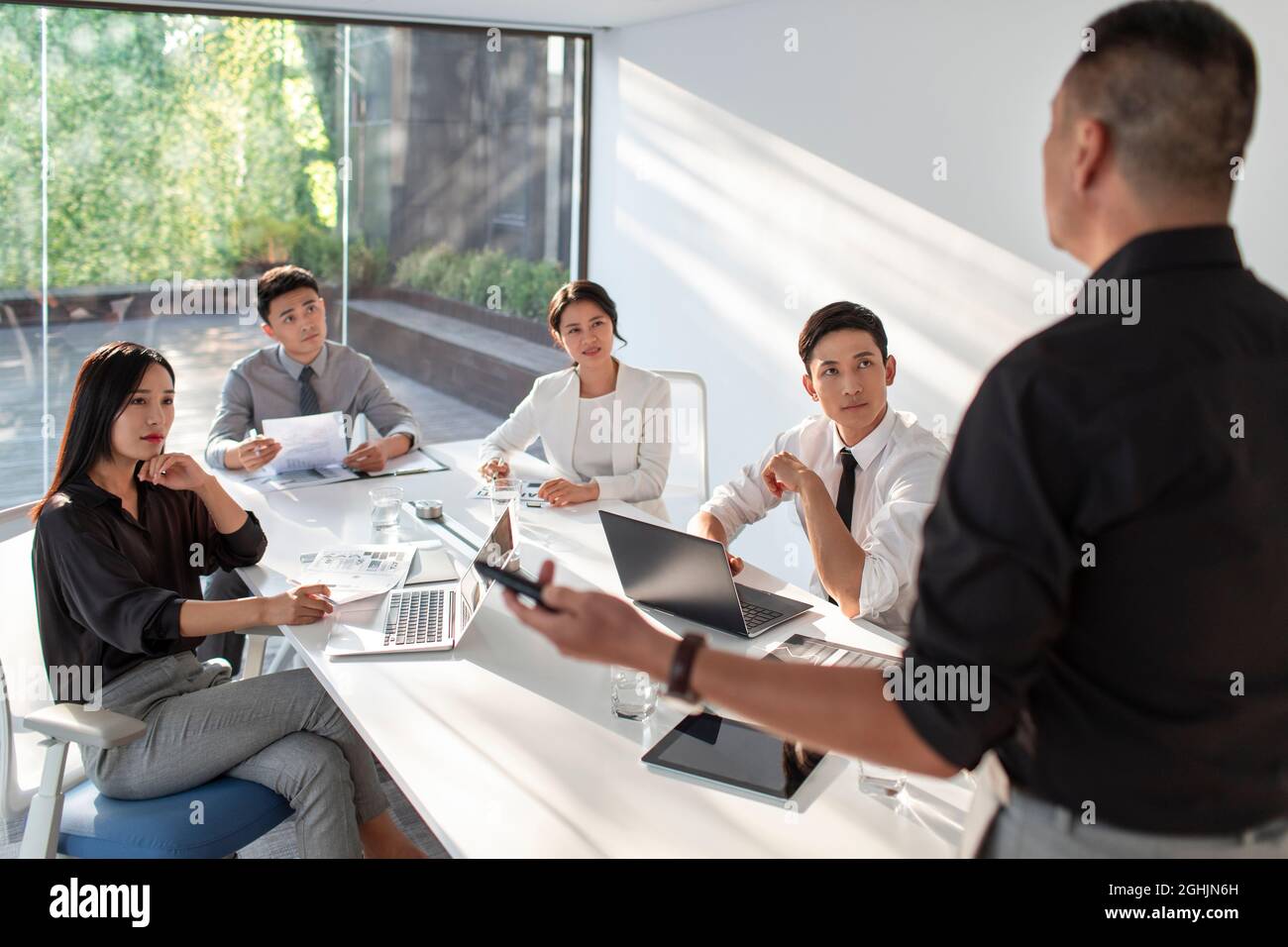 Business people having meeting in board room Stock Photo - Alamy