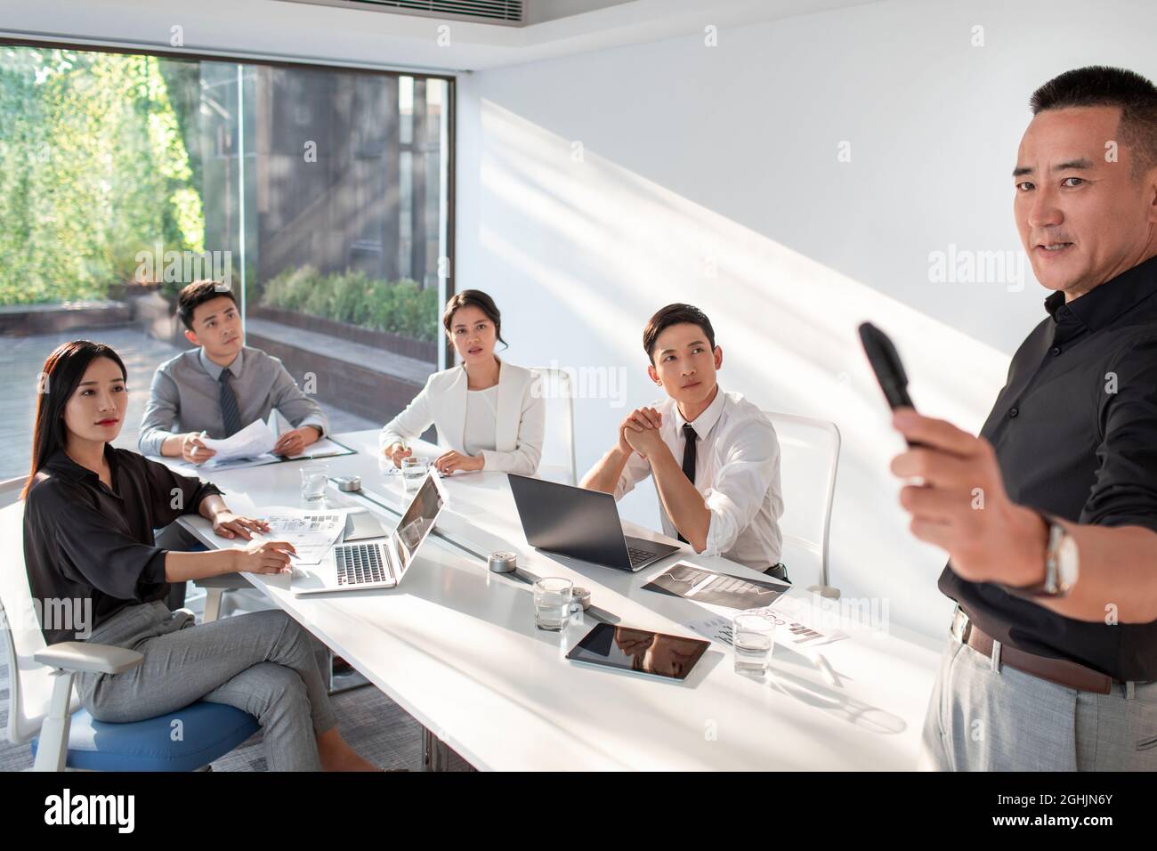 Business people having meeting in board room Stock Photo - Alamy