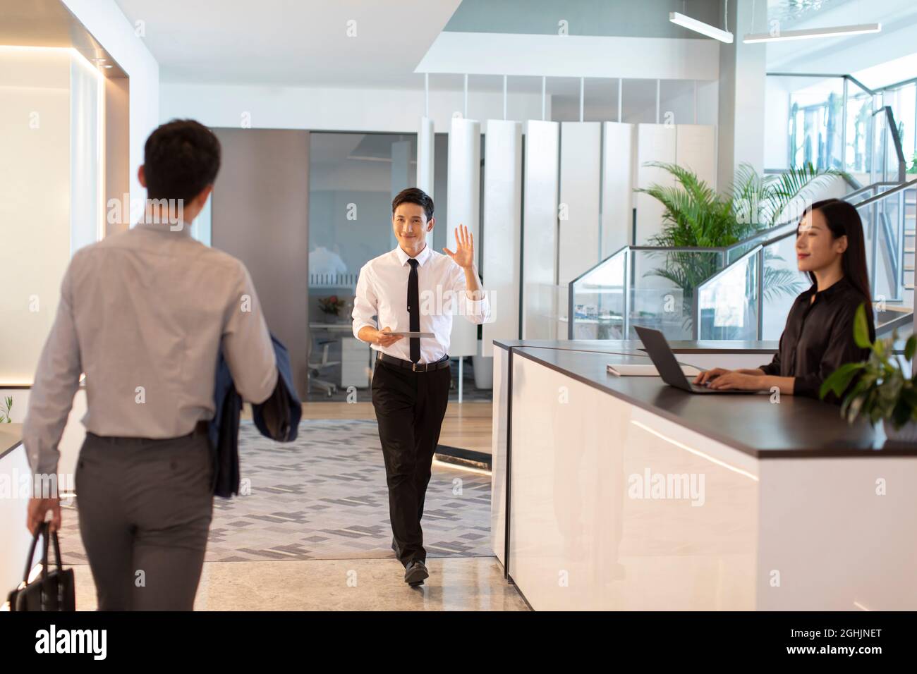 Business people greeting in office hi-res stock photography and images ...