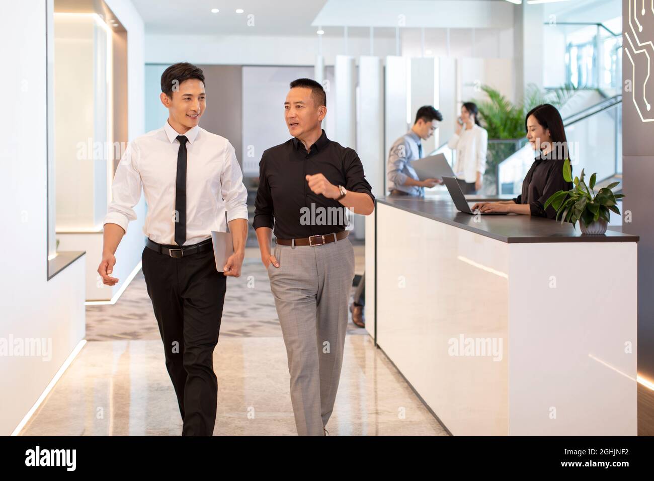 Business people talking in office Stock Photo - Alamy
