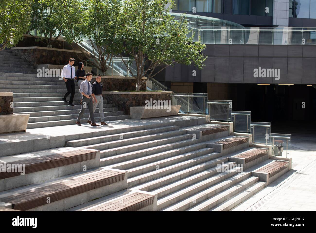 Business people walking outdoors Stock Photo - Alamy