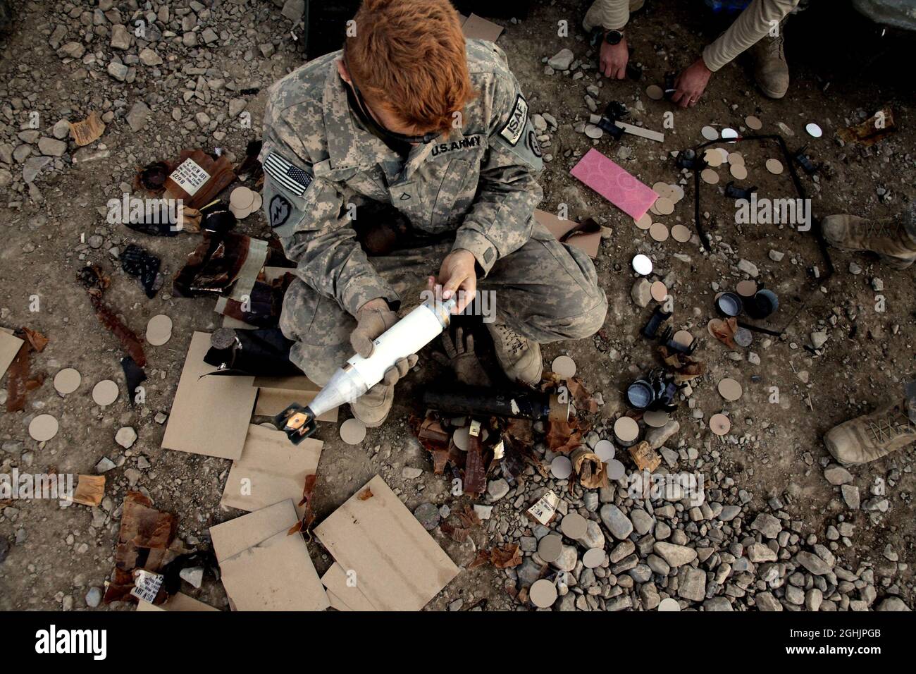 U.S. Army Pfc. Jerrod Lynch, from Dallas, Texas, removes packaging from ...