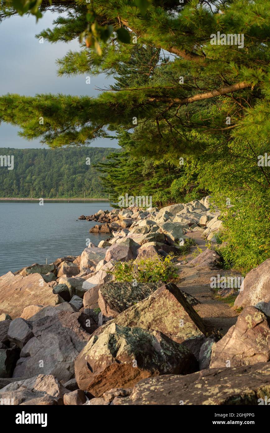 Tumbled Rocks trail around Devils Lake at sunrise. Devils Lake state ...