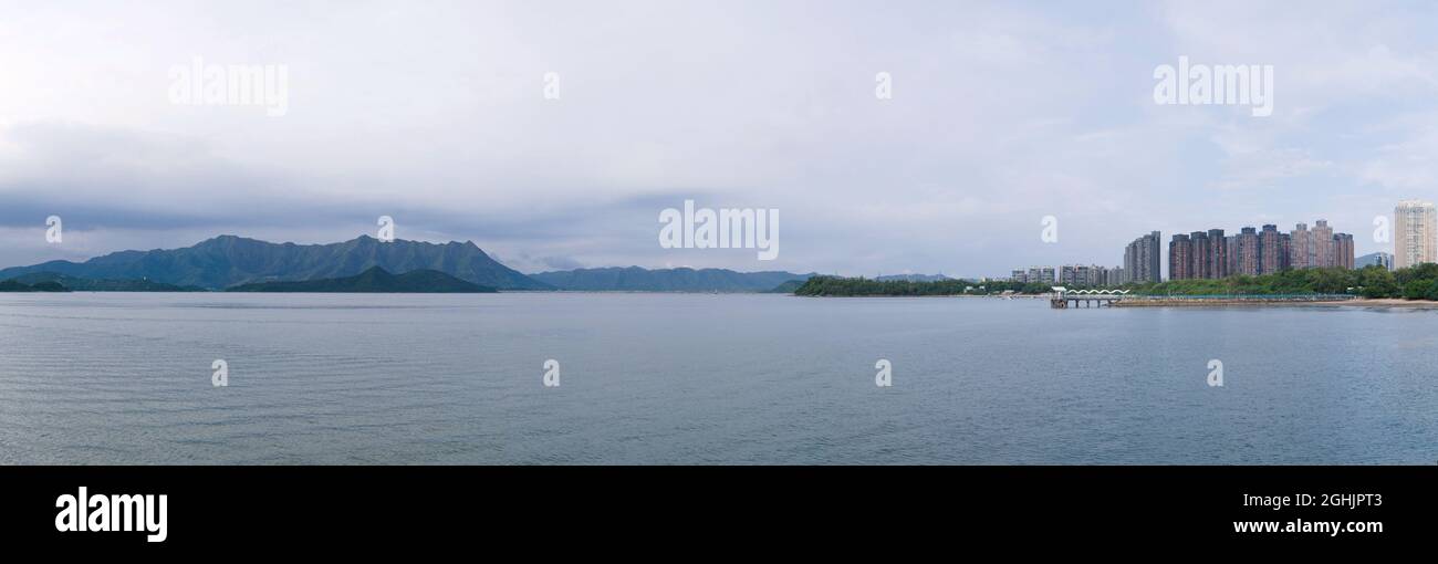 Ma On Shan Promenade Panorama: Mountain, high-rise building, pier and ...