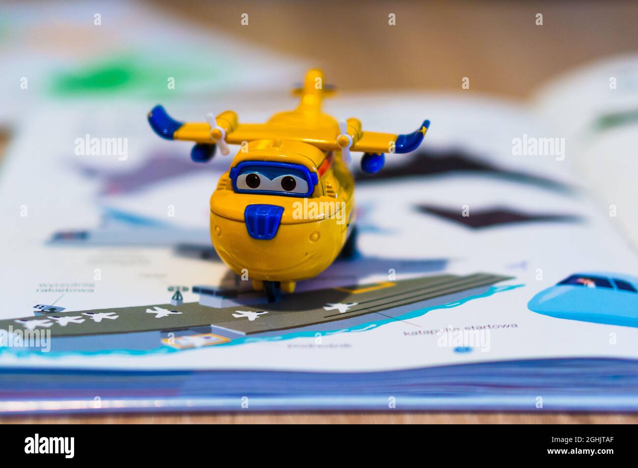 POZNAN, POLAND - Oct 21, 2018: A yellow Super Wings Donnie toy model ...