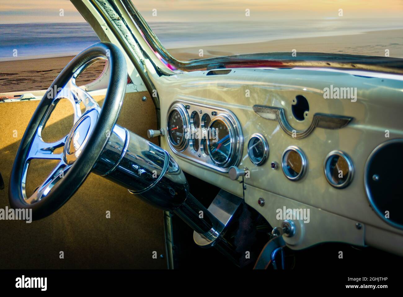 Closeup of shiny interior details of a vintage car under the lights ...