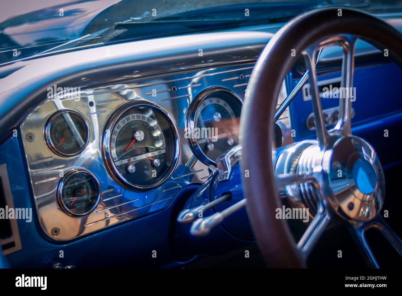 Closeup of shiny interior details of a vintage car under the lights ...