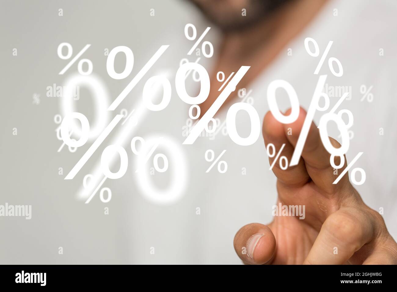 Person pointing at 3D rendered white percent signs Stock Photo - Alamy