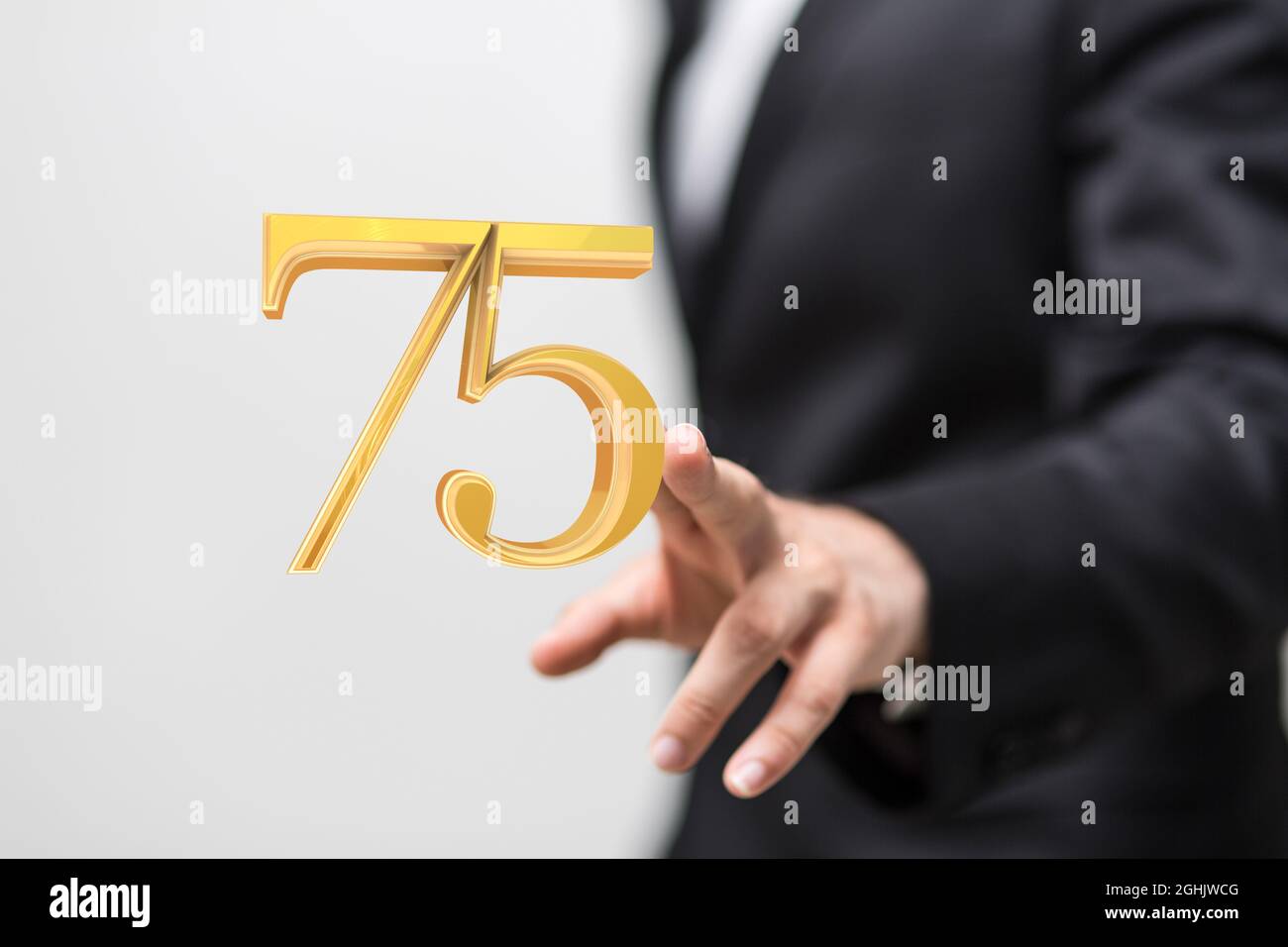 Person touching a 3D rendered golden number 75 Stock Photo - Alamy