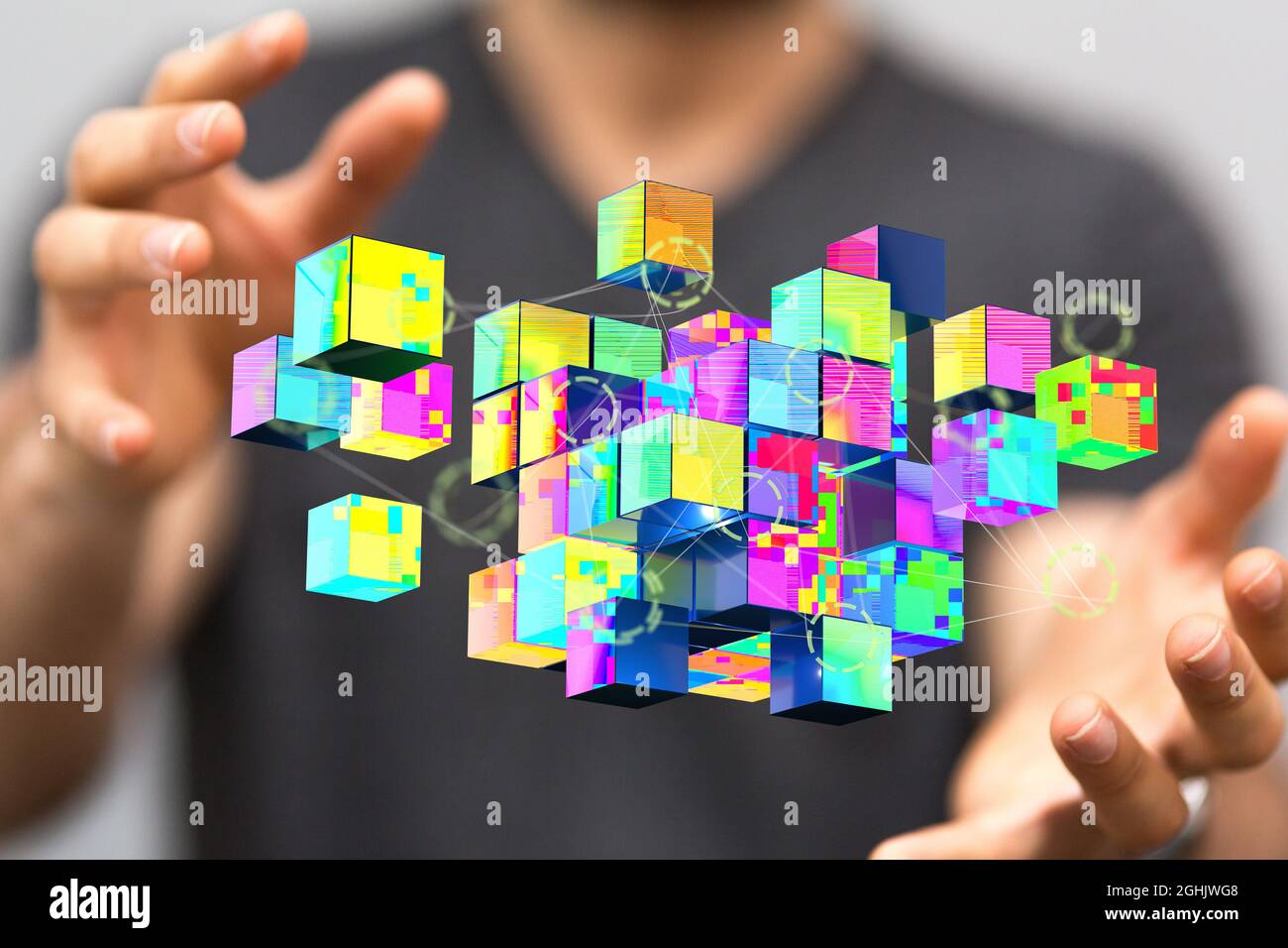 3d rendering of a colorful cube figure hovering between human hands ...