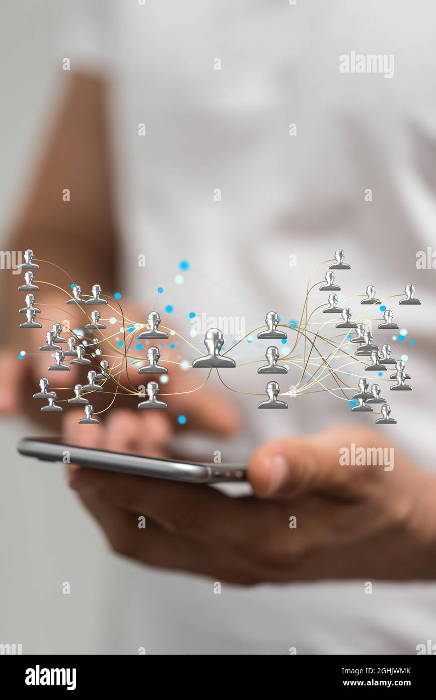 Hand holding a phone with person icons connected to each other - the ...