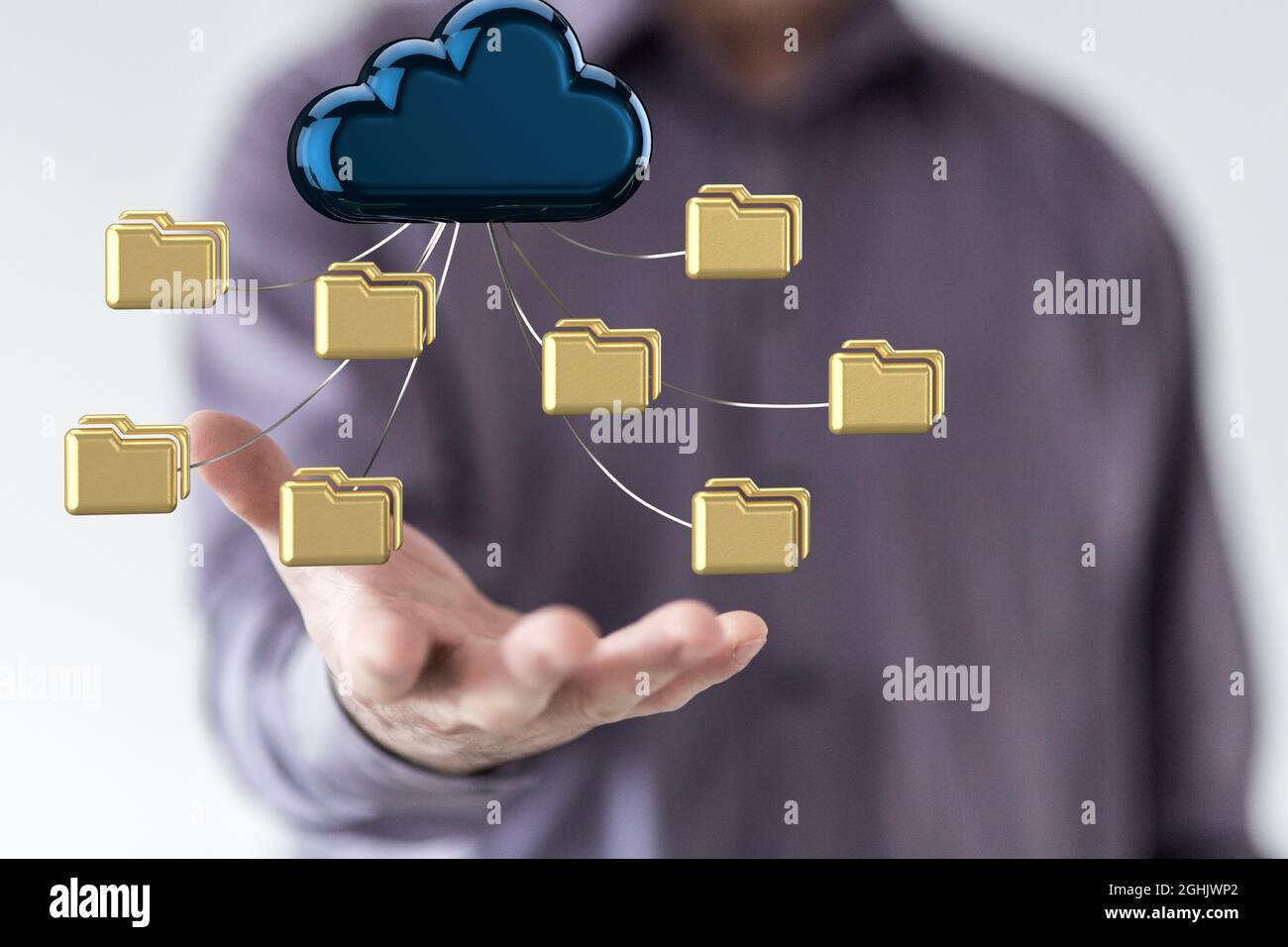 Hand holding a cloud icon with folders - the concept of cloud computing Stock Photo - Alamy