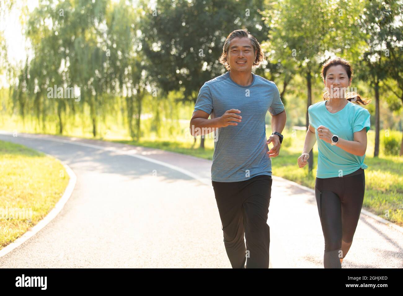 Happy mature chinese couple running hi-res stock photography and images - Alamy