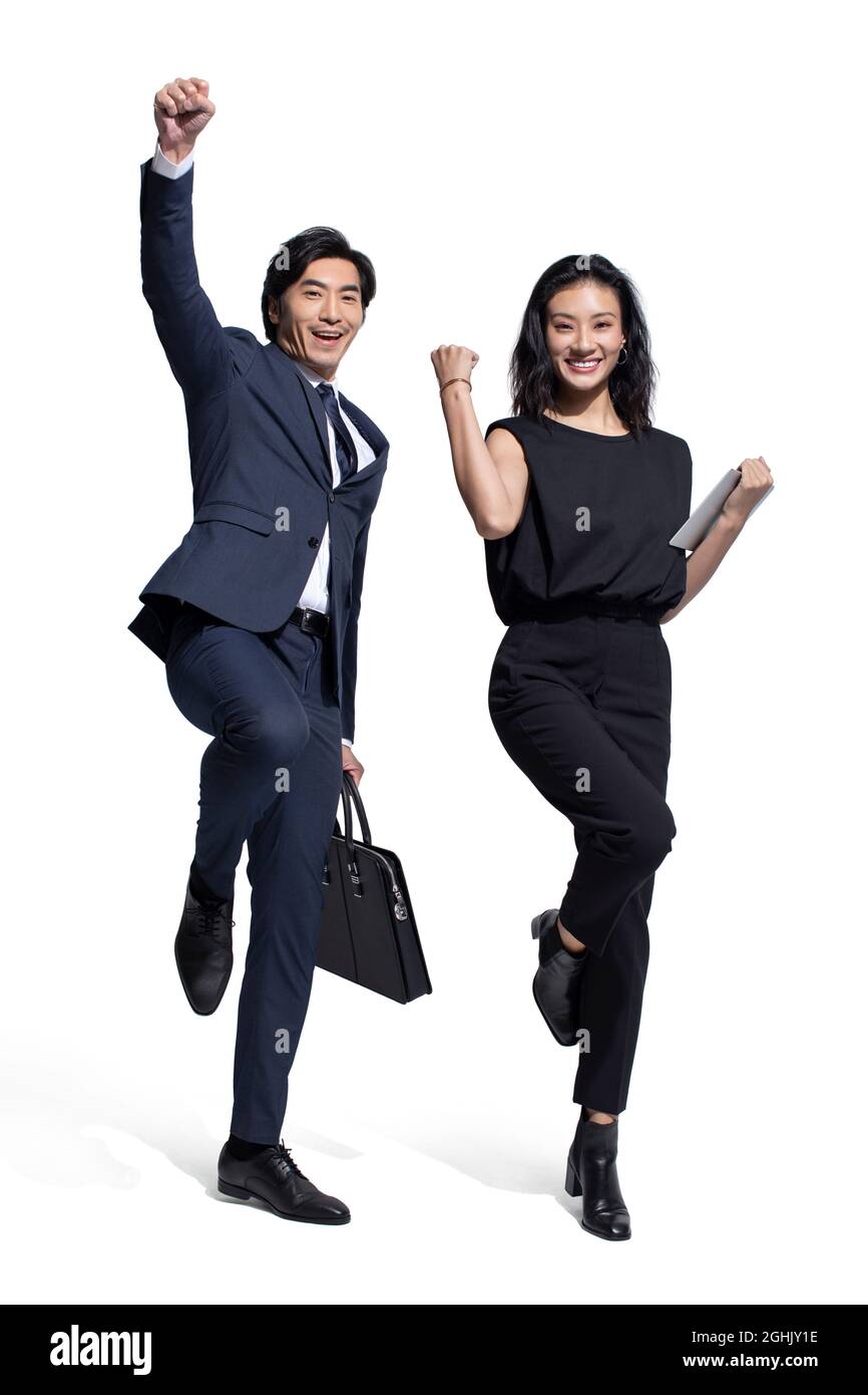 Cheerful business people punching the air Stock Photo - Alamy