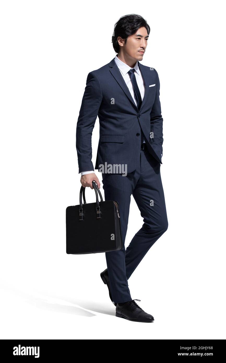 Confident businessman with a briefcase Stock Photo - Alamy