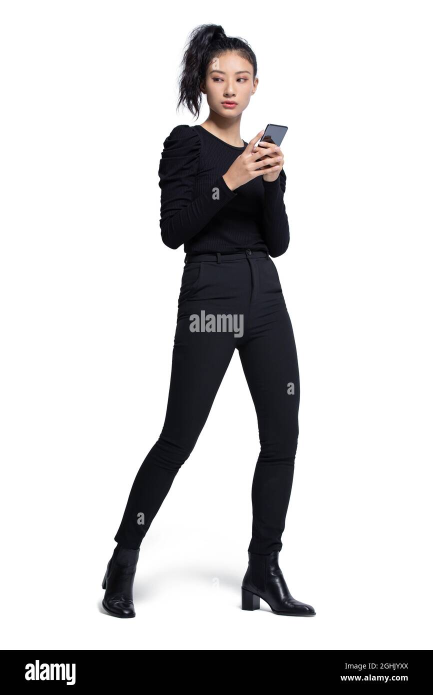 Woman smart phone standing Cut Out Stock Images & Pictures - Alamy