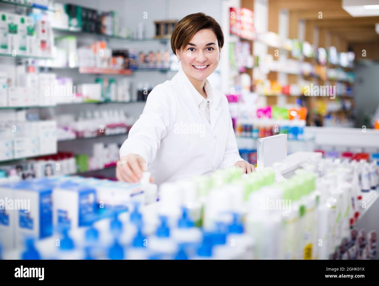 Pharmacist organizing assortment of care products Stock Photo - Alamy