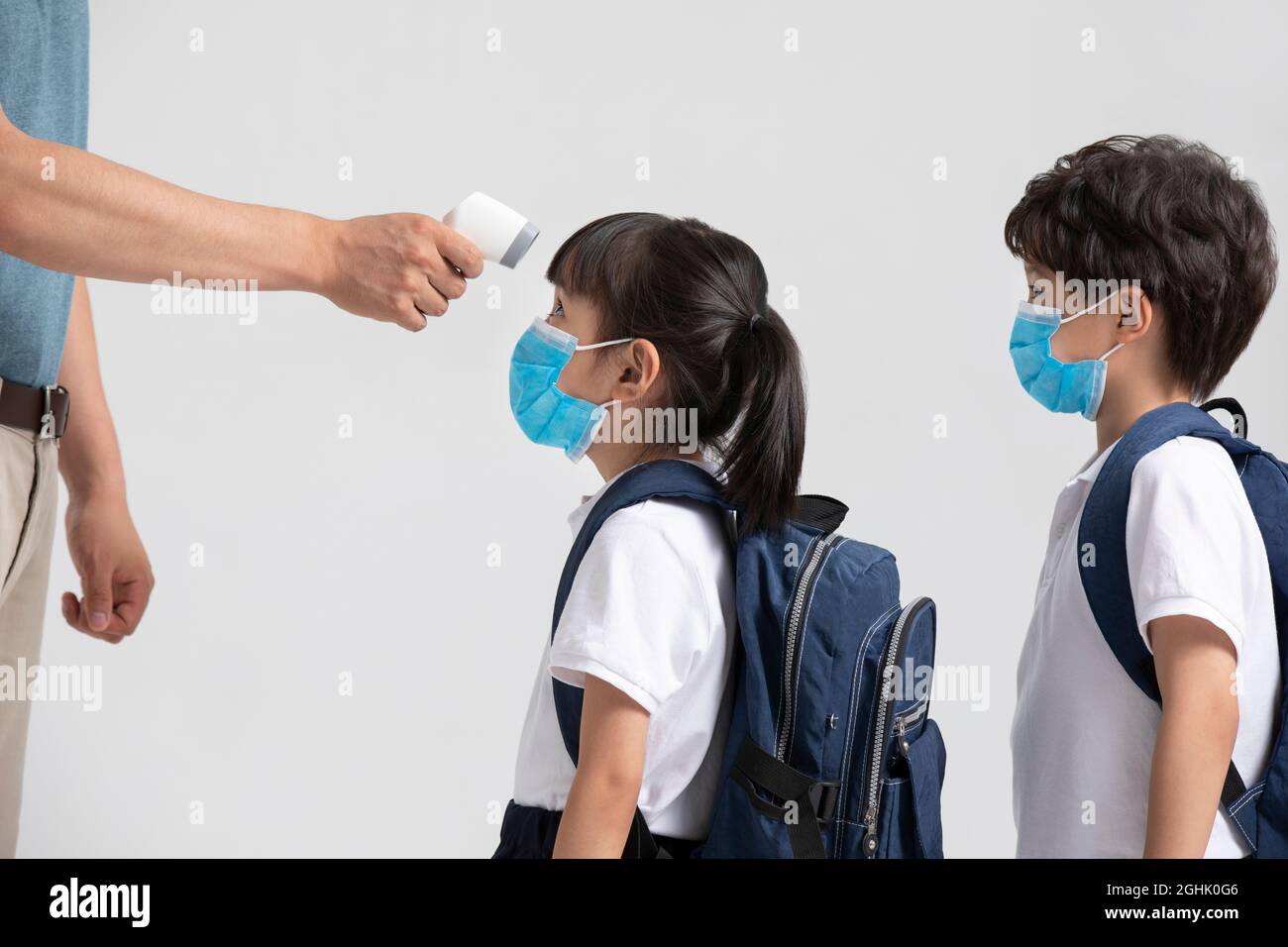 Measuring temperature with infrared thermometer before having the class ...