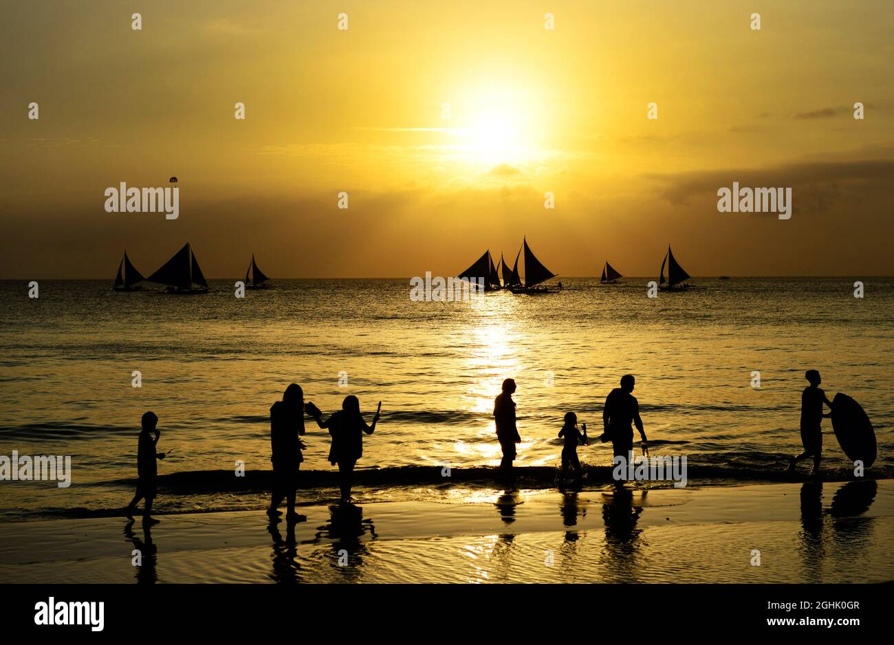 A romantic sunset enjoyed from the beach in Boracay island, Aklan ...