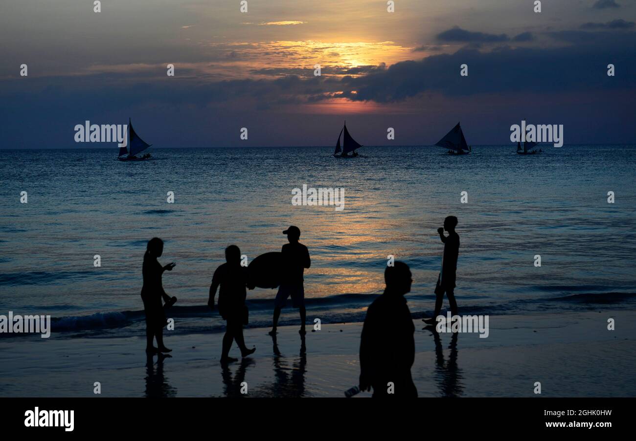 A romantic sunset enjoyed from the beach in Boracay island, Aklan ...