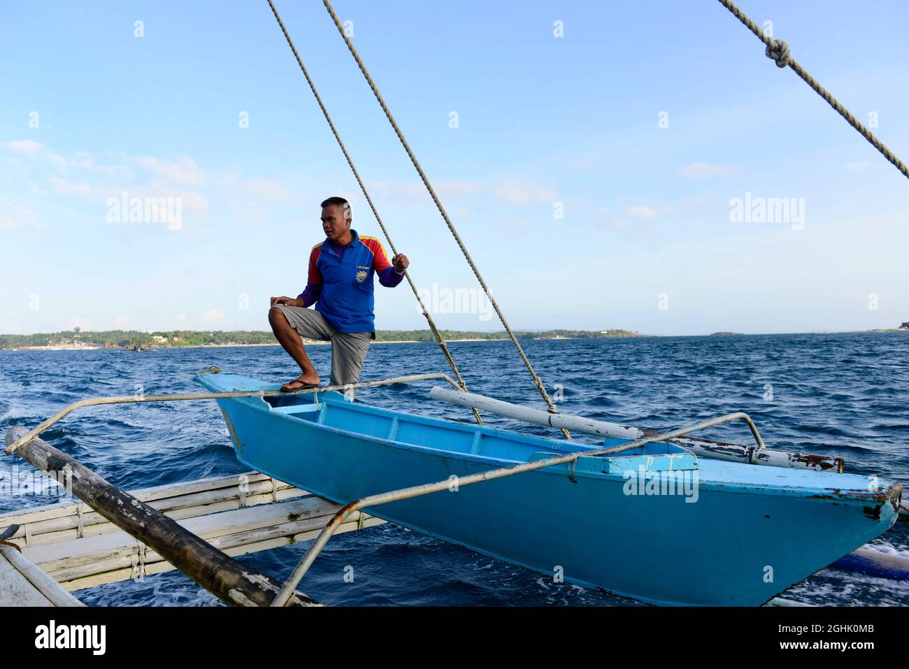 A worker on a boat to Boracay island in The Philippines Stock Photo - Alamy