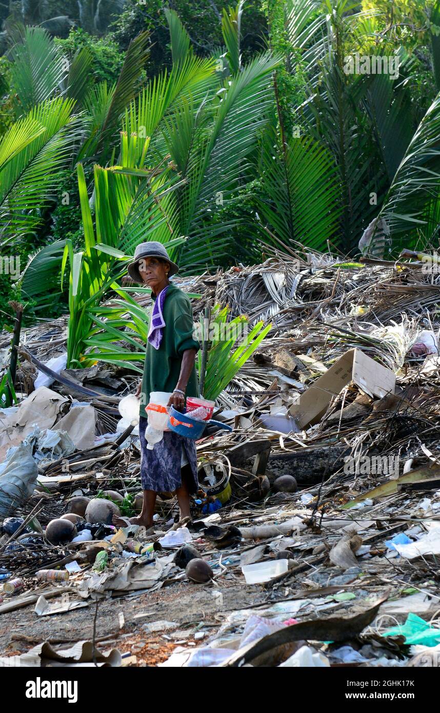 Reciycling waste at a dumping site on Boracay island in The Philippines ...