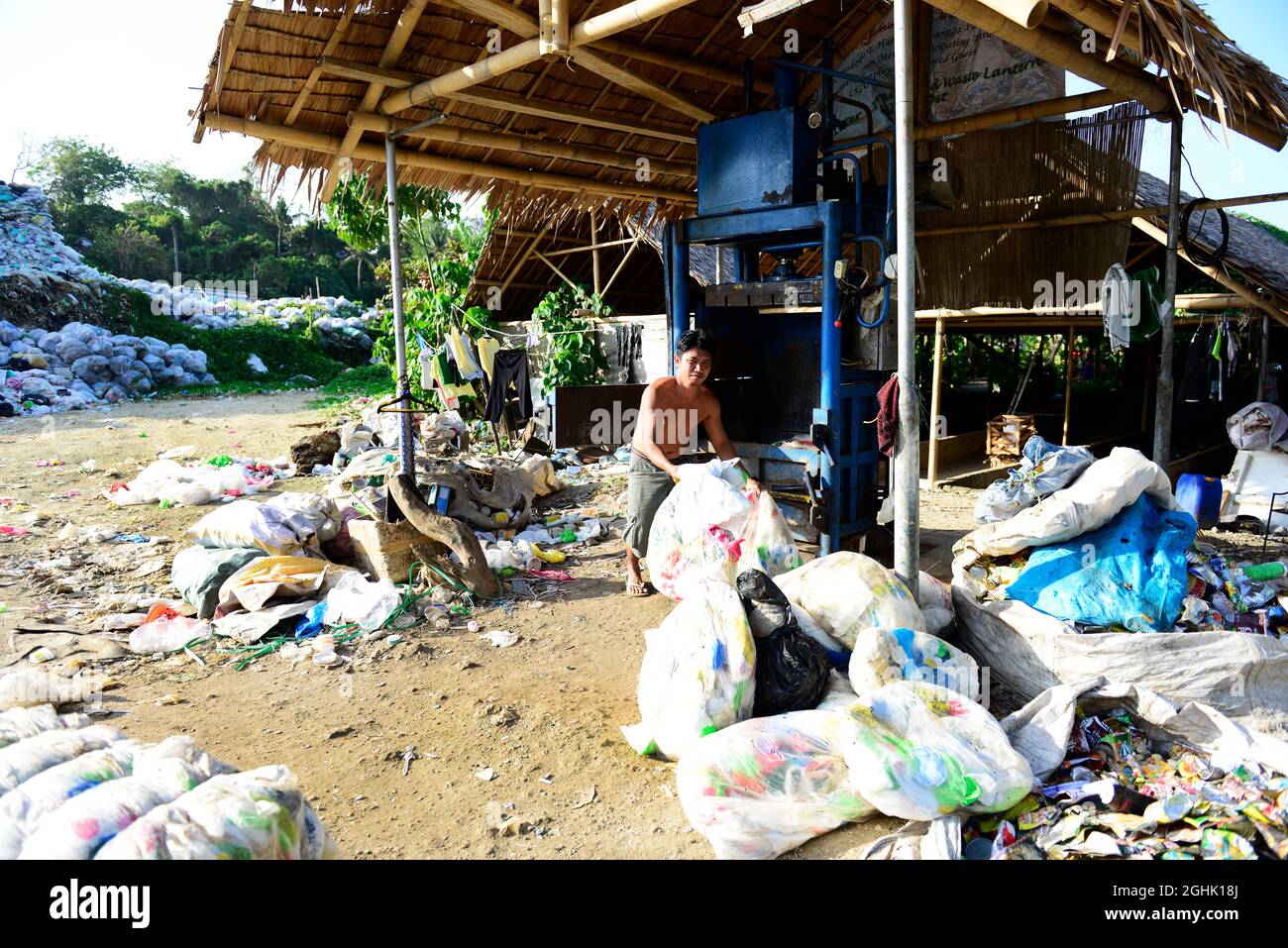 Reciycling waste at a dumping site on Boracay island in The Philippines ...