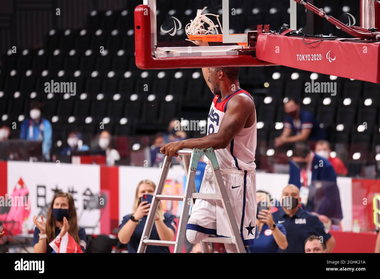 Brian Bell (USA) of Team USA cuts the basketball hoop net to celebrate ...