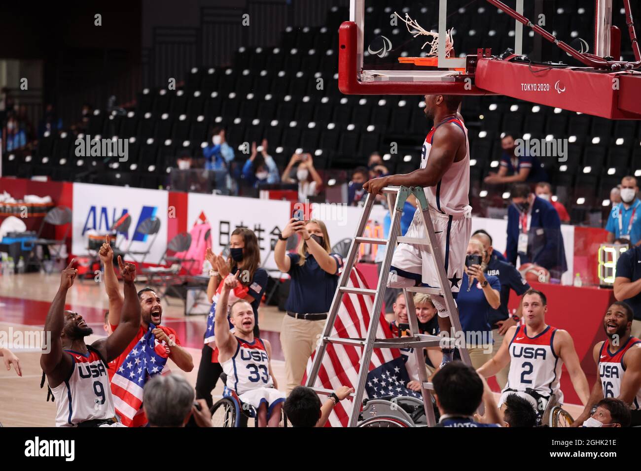 Brian Bell (USA) of Team USA cuts the basketball hoop net to celebrate ...