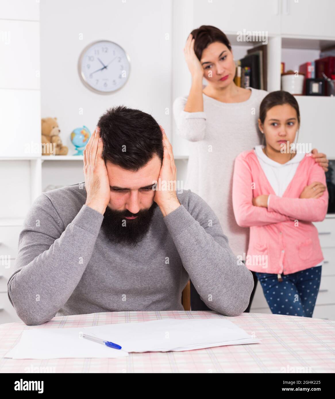 Mother lecturing husband and daughter Stock Photo - Alamy
