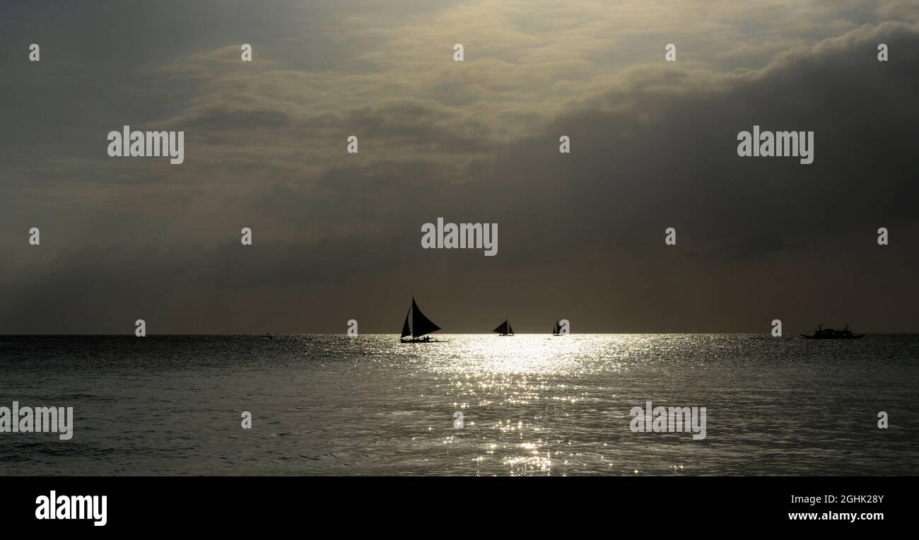 A romantic sunset enjoyed from the beach in Boracay island, Aklan ...