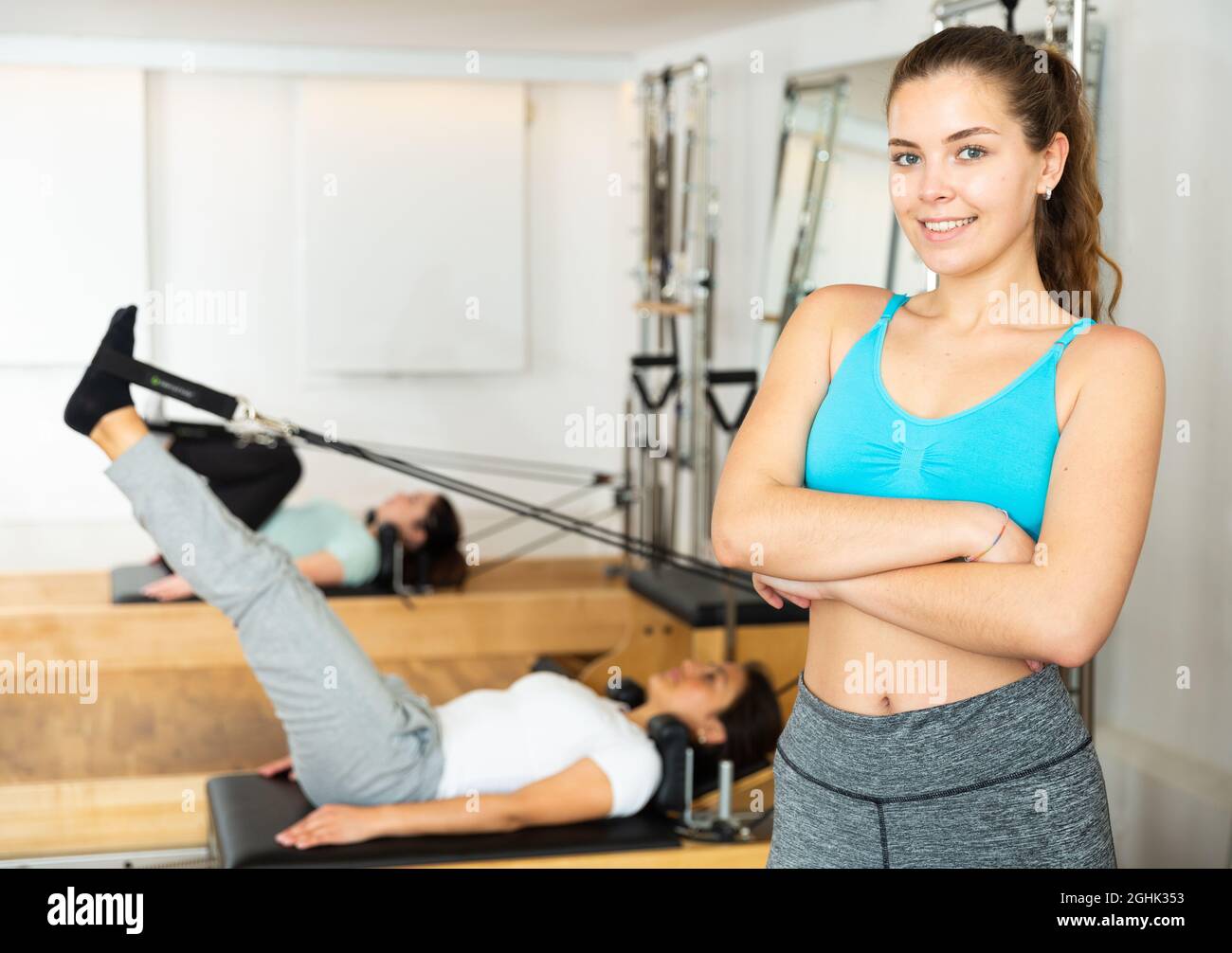 Young woman ready for training on reformer in pilates studio Stock ...