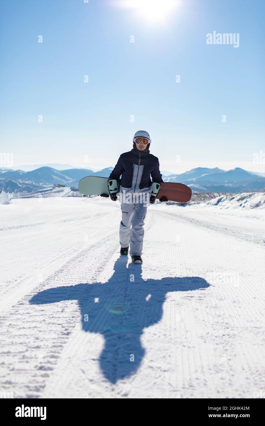 Young man walking on ski hi-res stock photography and images - Alamy