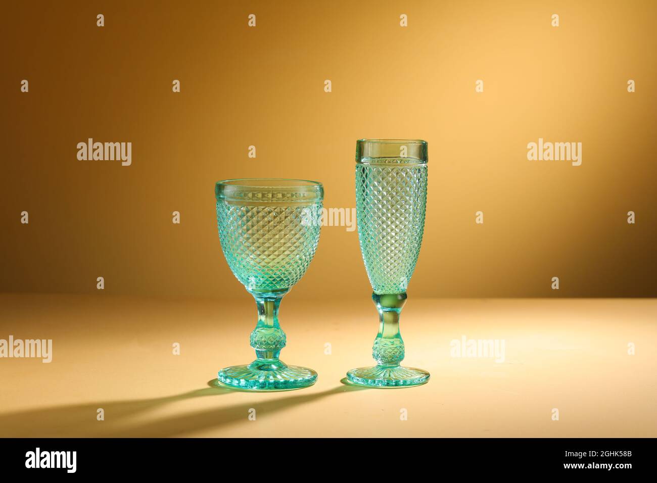 Two empty wine mint glasses color on a beige background Stock Photo - Alamy