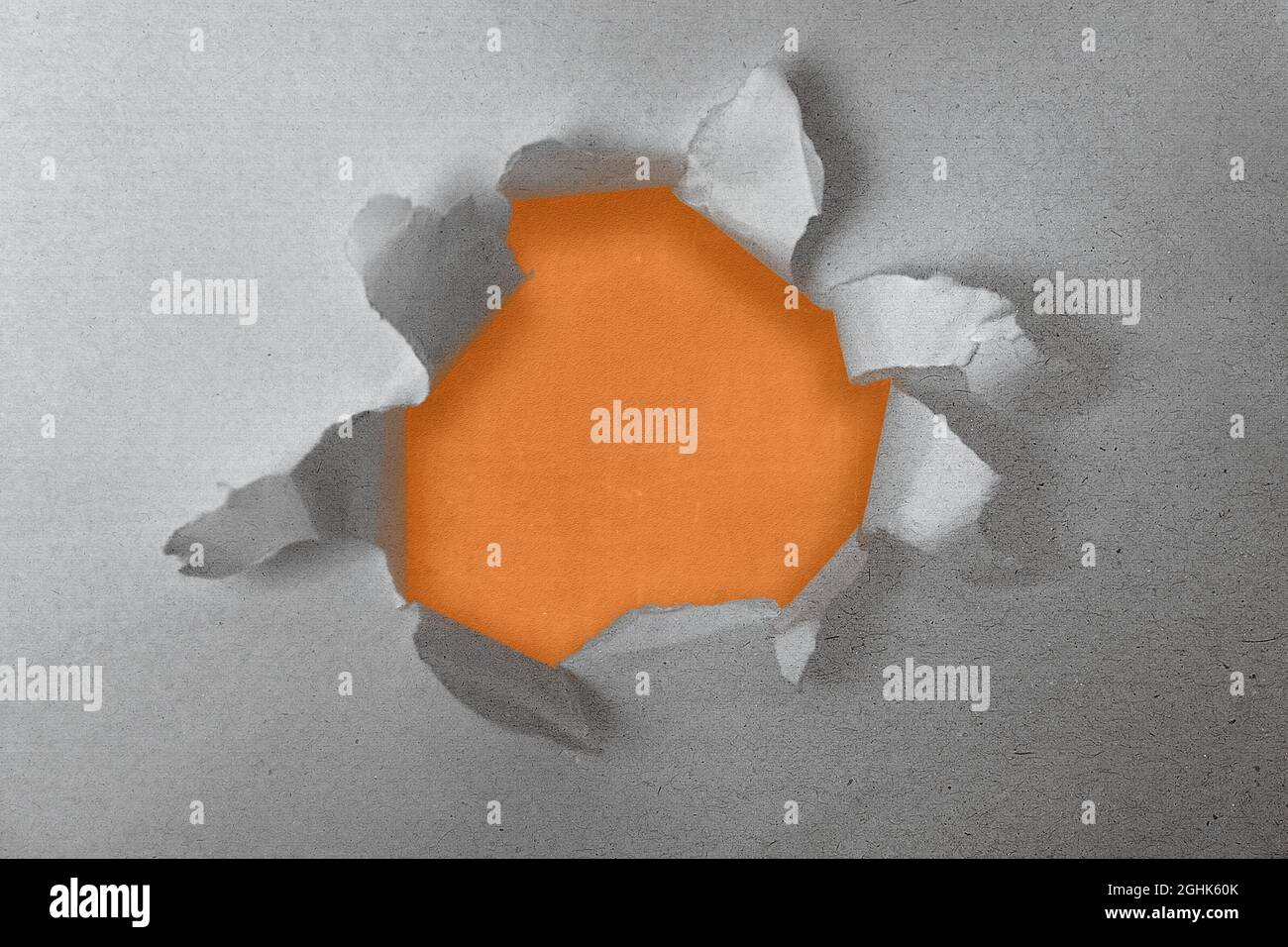 Paper with a hole torn in the middle with colored background Stock ...