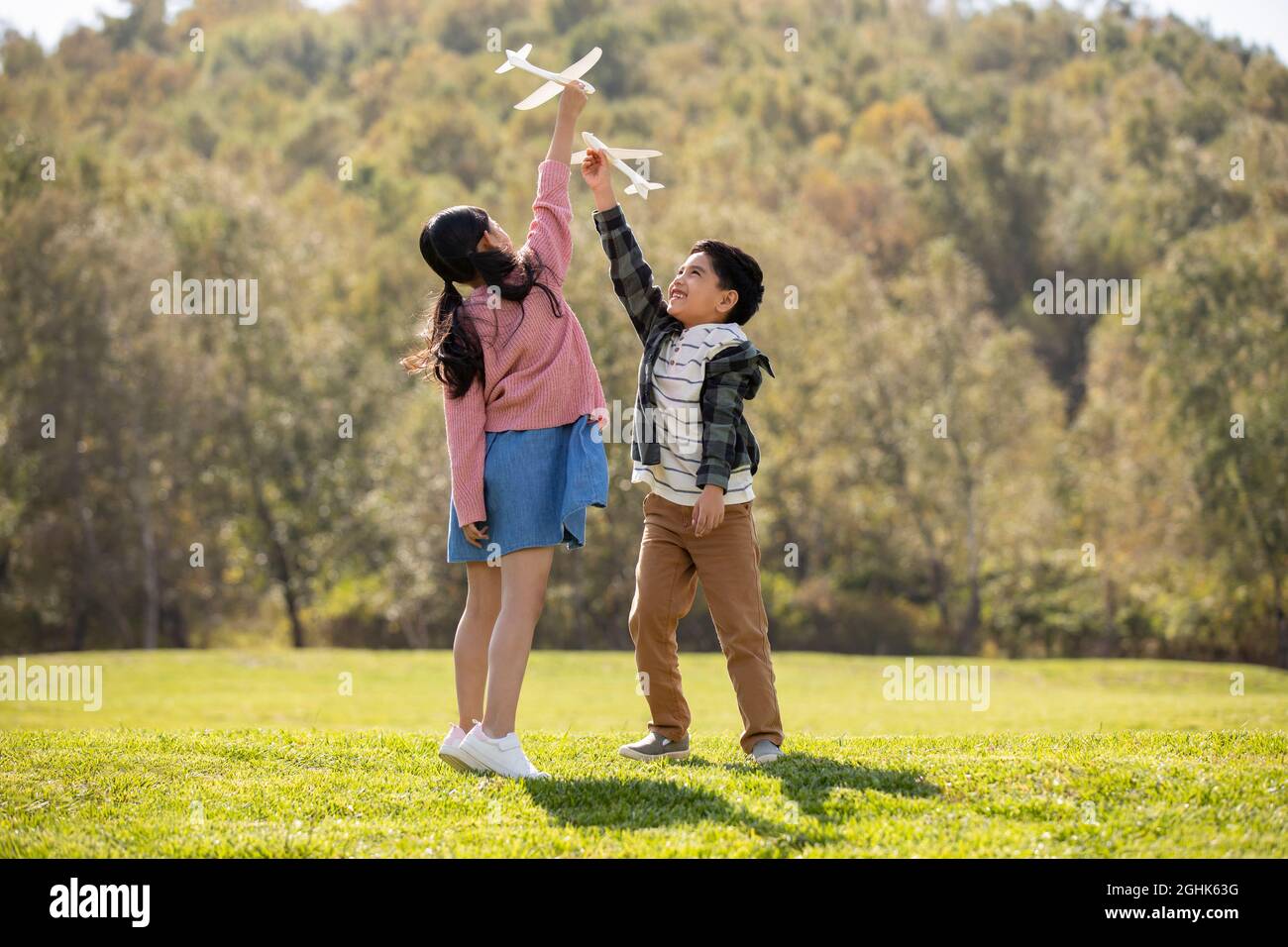 Happy children playing on meadow Stock Photo - Alamy