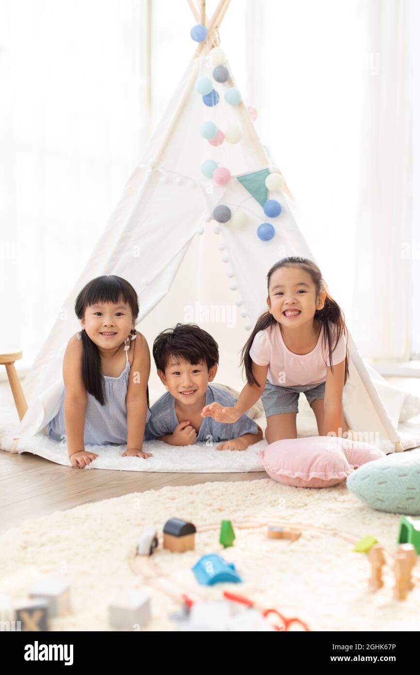 Cute children playing in tent Stock Photo - Alamy
