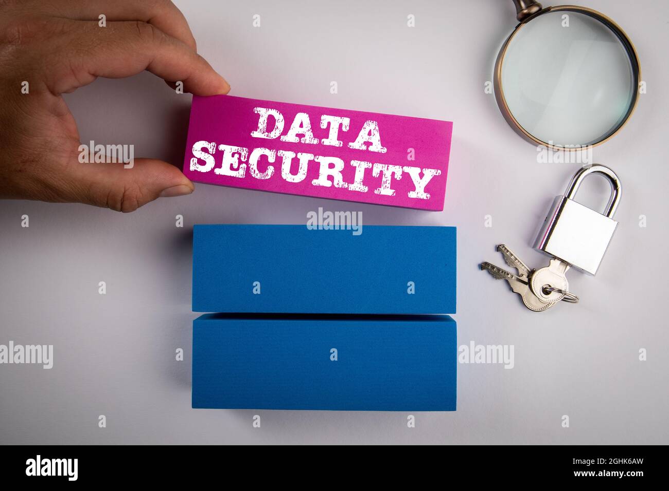 Data Security. Colored blocks, padlock and magnifying glass on a white ...
