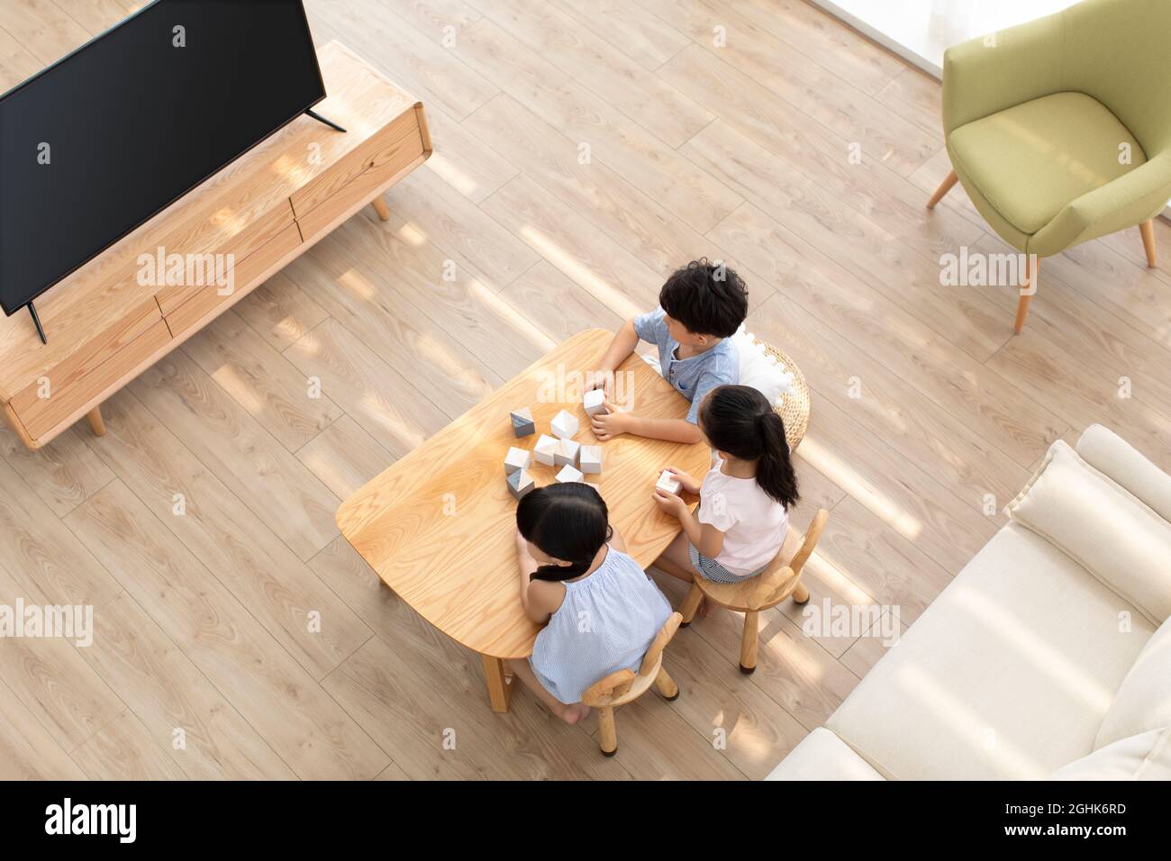 Cute children watching TV in living room Stock Photo - Alamy