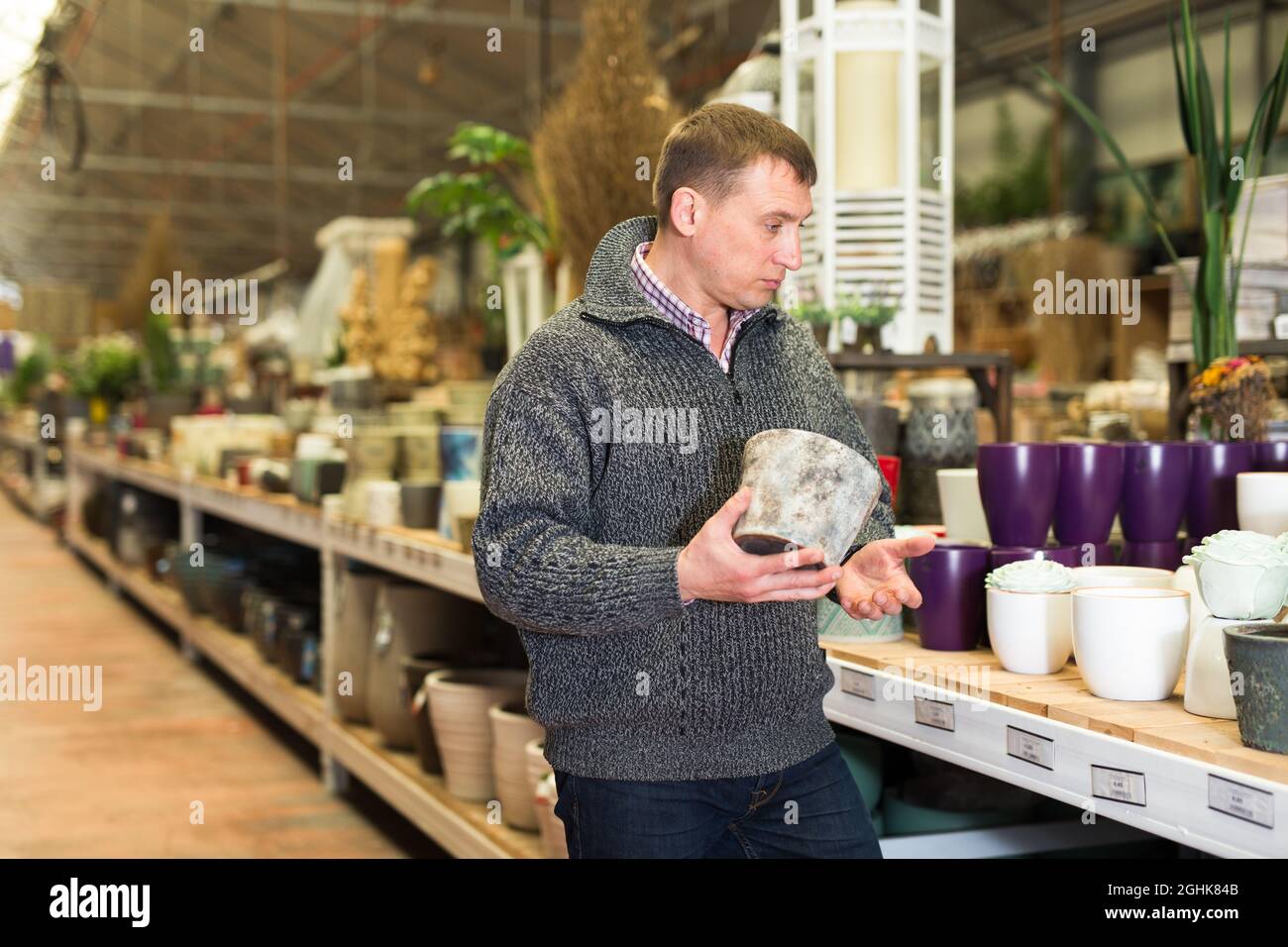 Portrait man choosing pots hi-res stock photography and images - Alamy