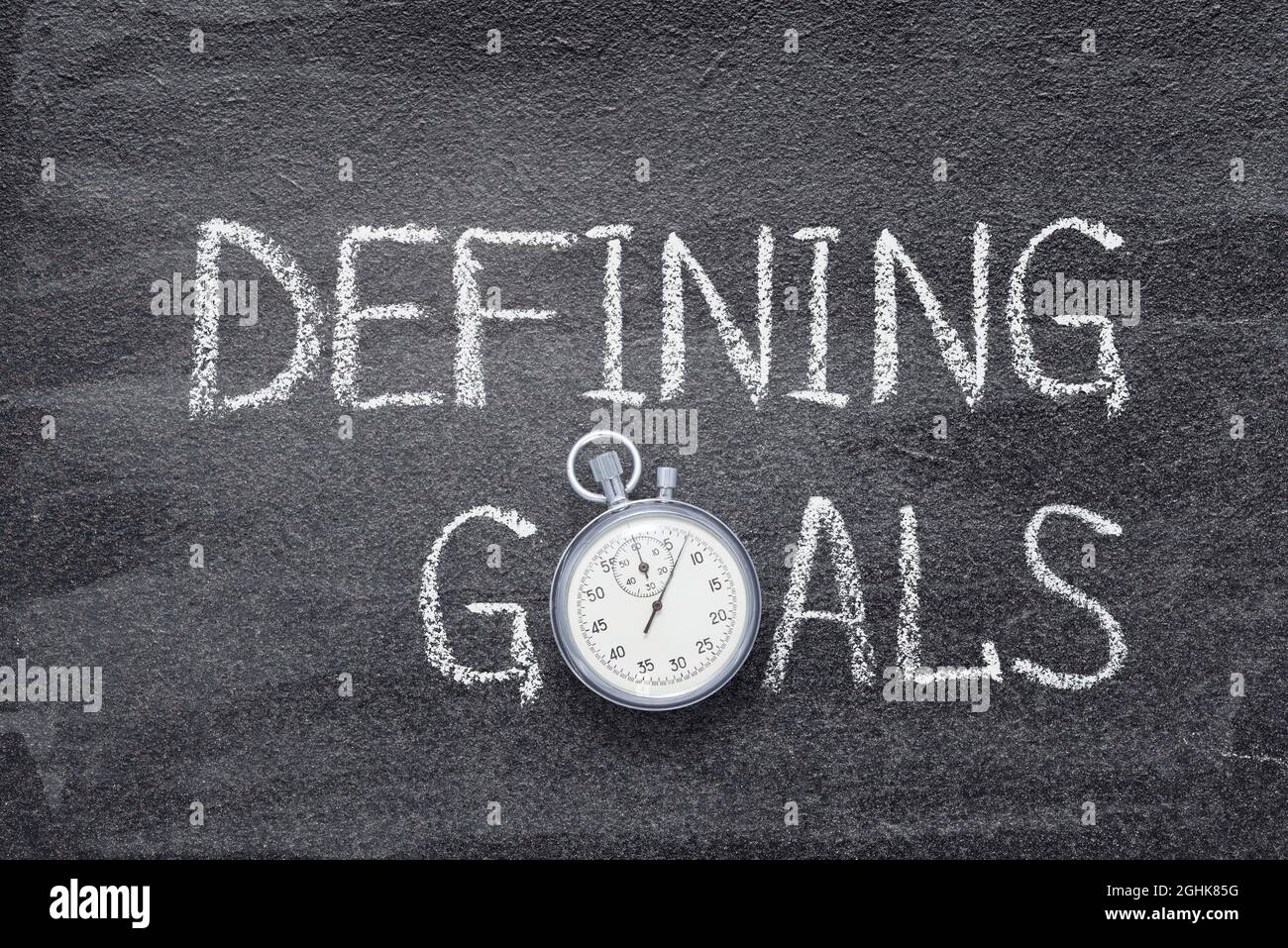 defining goals phrase written on chalkboard with vintage precise ...