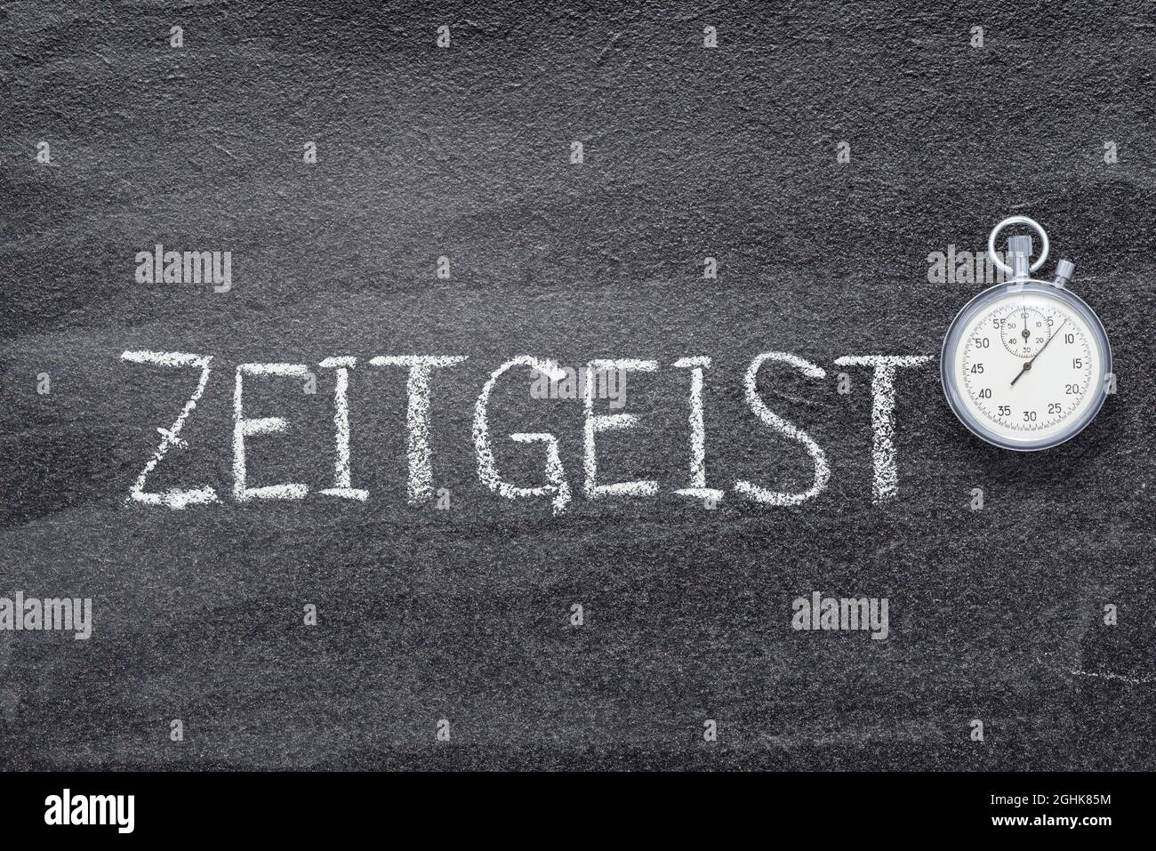 zeitgeist word written on chalkboard with vintage precise stopwatch ...