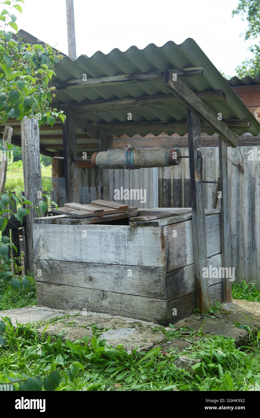 Indoor wooden well in the village Stock Photo - Alamy