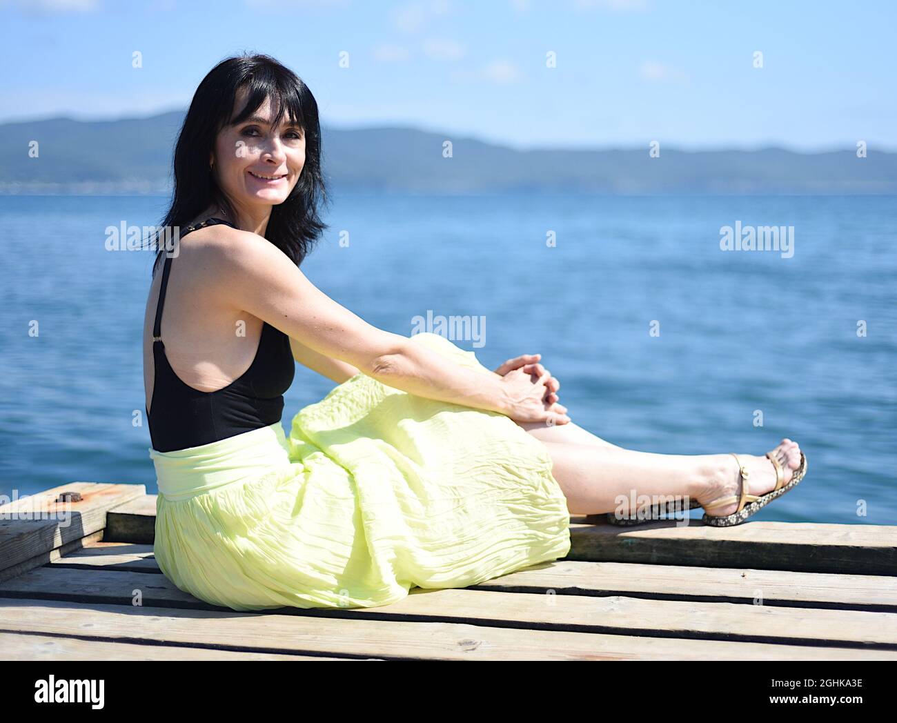45 Years Old Russian Woman Smiling And Looking At Front Against
