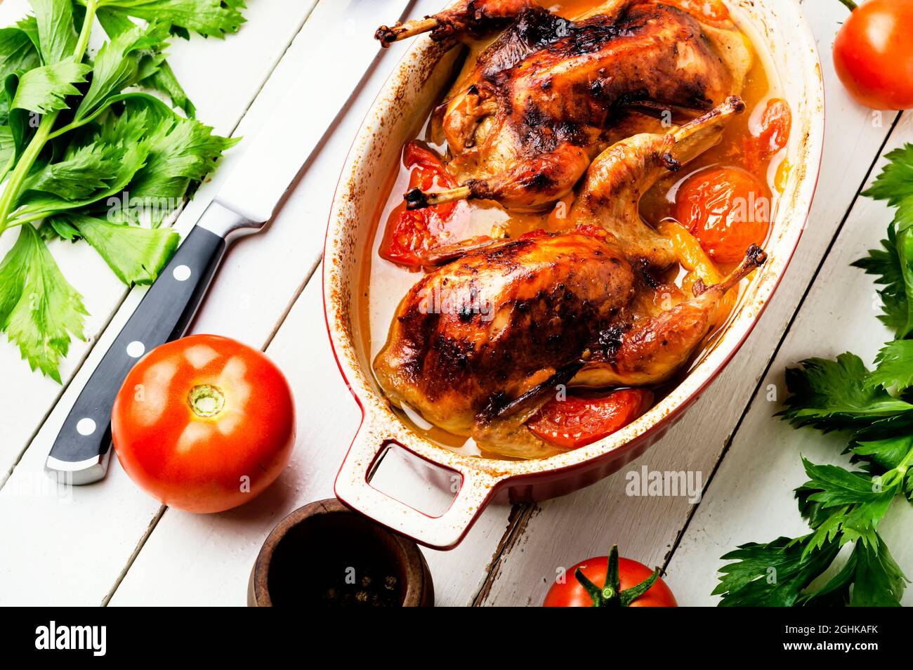 Whole quails roasted in tomato sauce. Fried quails meat Stock Photo - Alamy