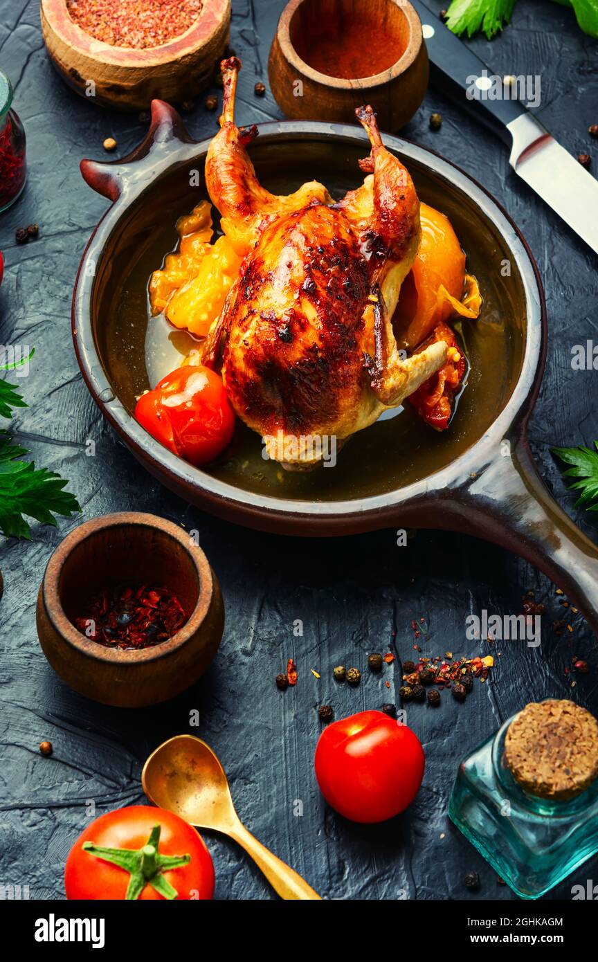 Whole quails roasted in tomato sauce. Fried quails meat Stock Photo - Alamy