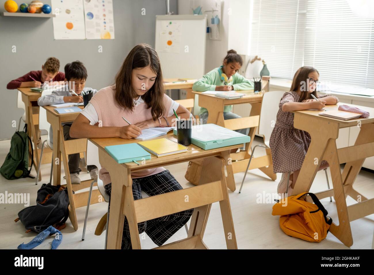 Row of school desks hi-res stock photography and images - Alamy