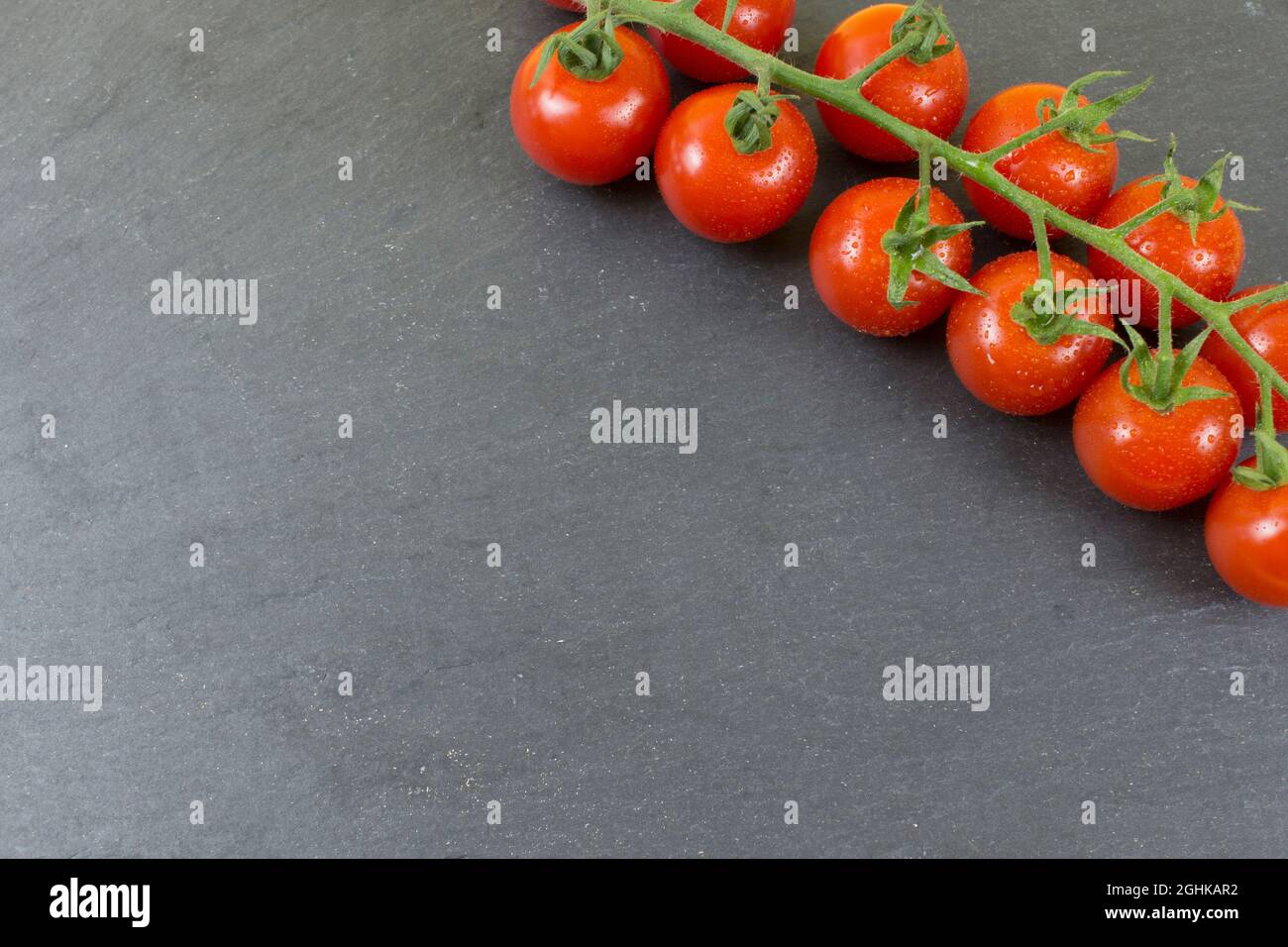 Black red cherry tomatoes hi-res stock photography and images - Alamy