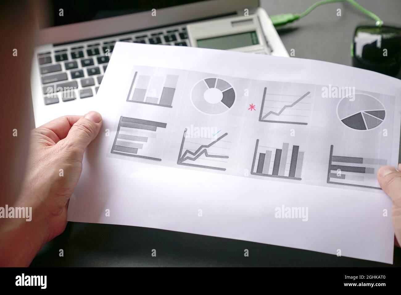 Man holding and analyzing charts and graphs. Investment portfolio ...
