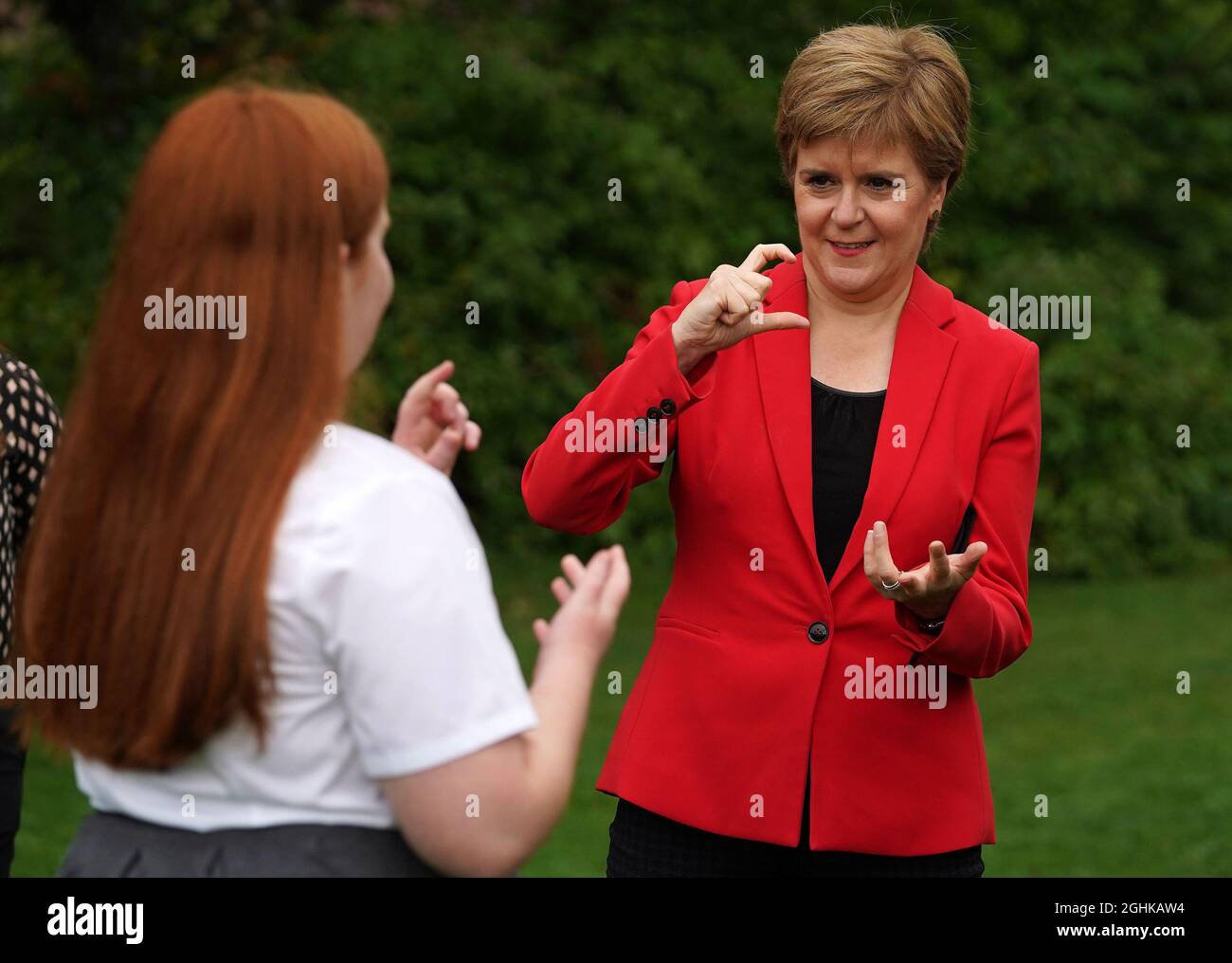 First Minister of Scotland Nicola Sturgeon is shown sign language ...